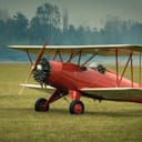 biplane (【Noun】a type of airplane with two main pairs of wings placed ...