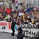 banner (【Noun】a large piece of cloth with a message or design on it ...