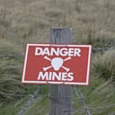 mine (【Noun】a type of bomb placed under the ground or water that ...