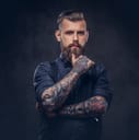 tatted (【Adjective】having a lot of tattoos, especially so that the skin ...