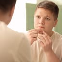 undergo (【Verb】to go through or experience, usually something difficult ...