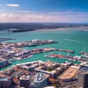 harbor (【Noun】an area of water near land where boats can safely dock ...