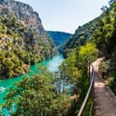 gorge (【Noun】a narrow valley between hills or mountains, typically with ...