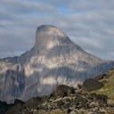 rock face (【Noun】a vertical surface of a large rock or mountain ...