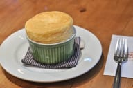 soufflé (【Noun】a dish made from eggs, milk, flour and cheese or fruit ...